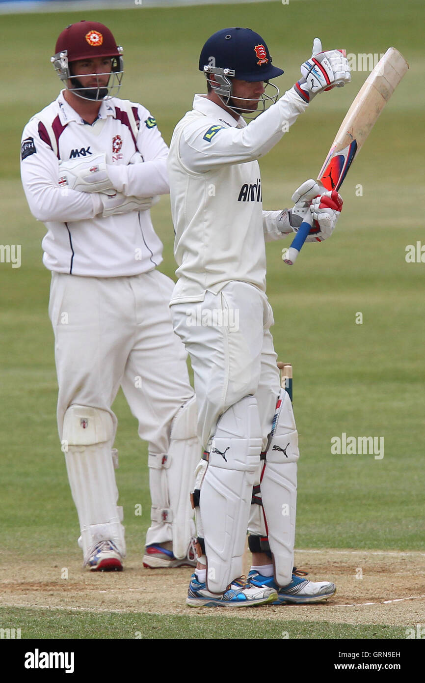 Bobby Quiney of Essex gives the thumbs up to acknowledge a half-century ...