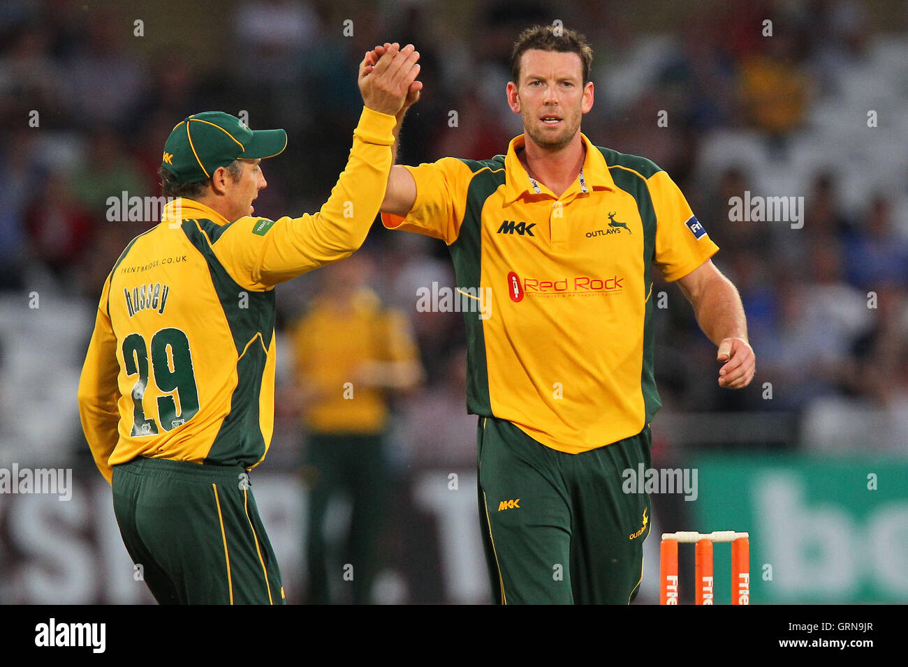 Ian Butler (R) of Nottinghamshire celebrates the wicket of James Foster ...