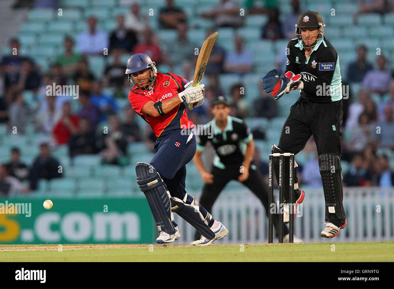 Greg Smith of Essex hits four runs as Gary Wilson looks on - Surrey ...
