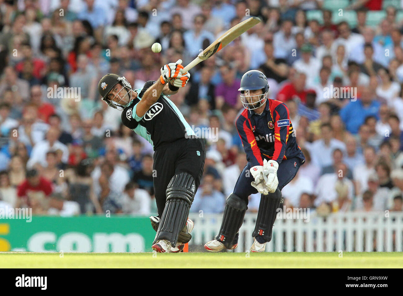 Glenn Maxwell in batting action for Surrey as James Foster looks on ...