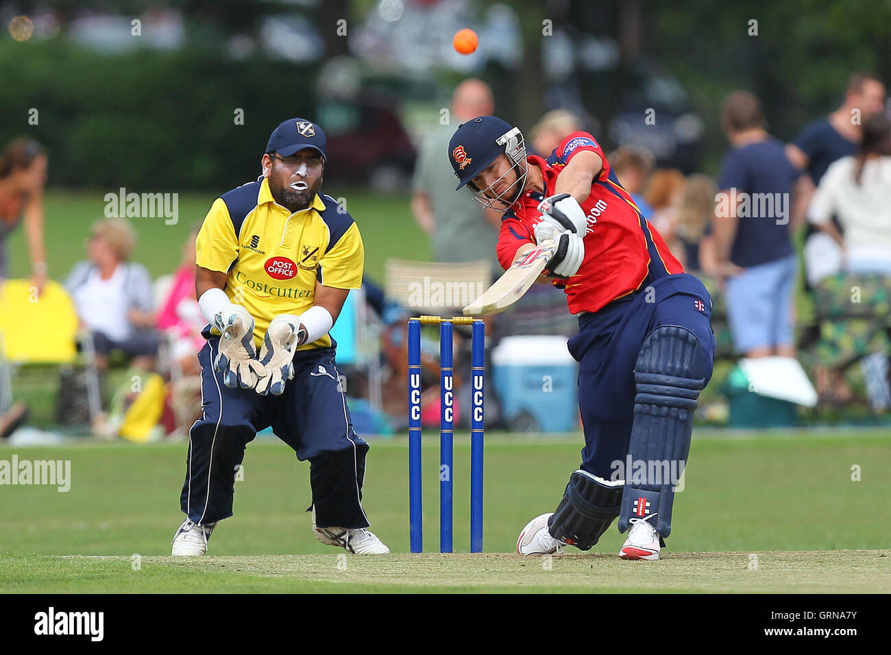Jaik Mickleburgh of Essex hits six runs as Freddie Butt looks on ...