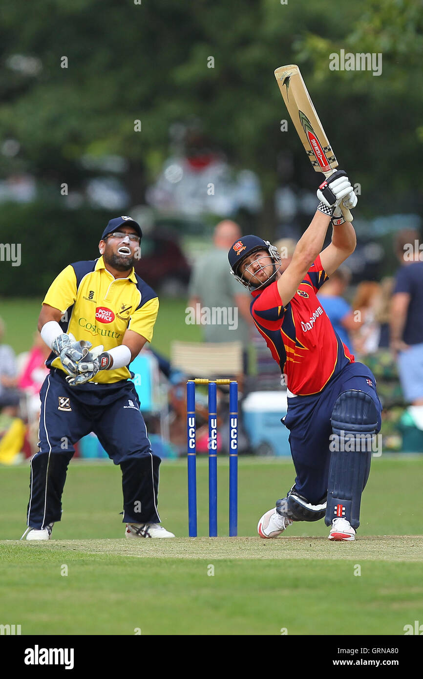 Jaik Mickleburgh of Essex hits six runs as Freddie Butt looks on ...