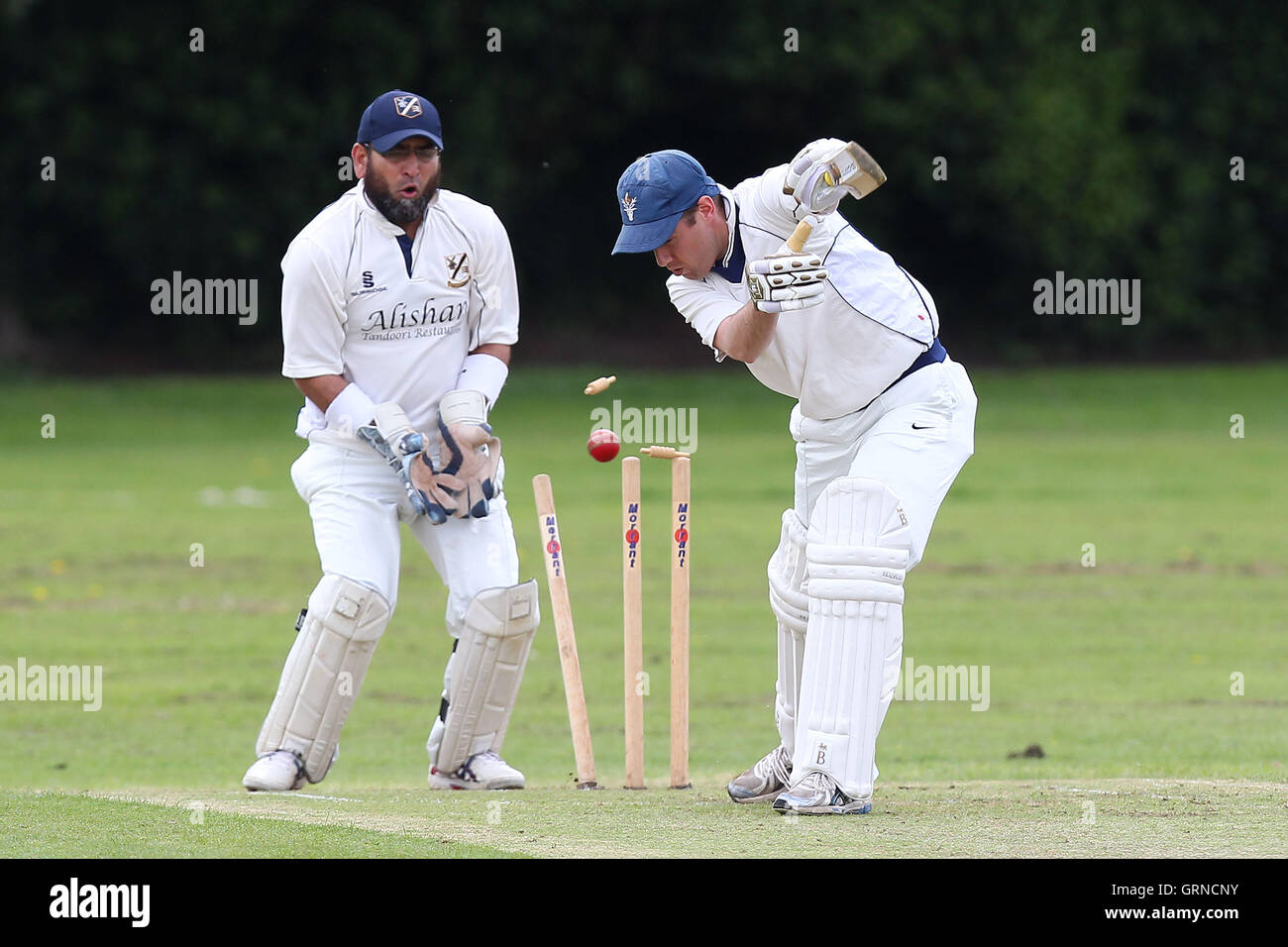 Andy Berry takes the second Chingford wicket as Freddie Butt looks on ...