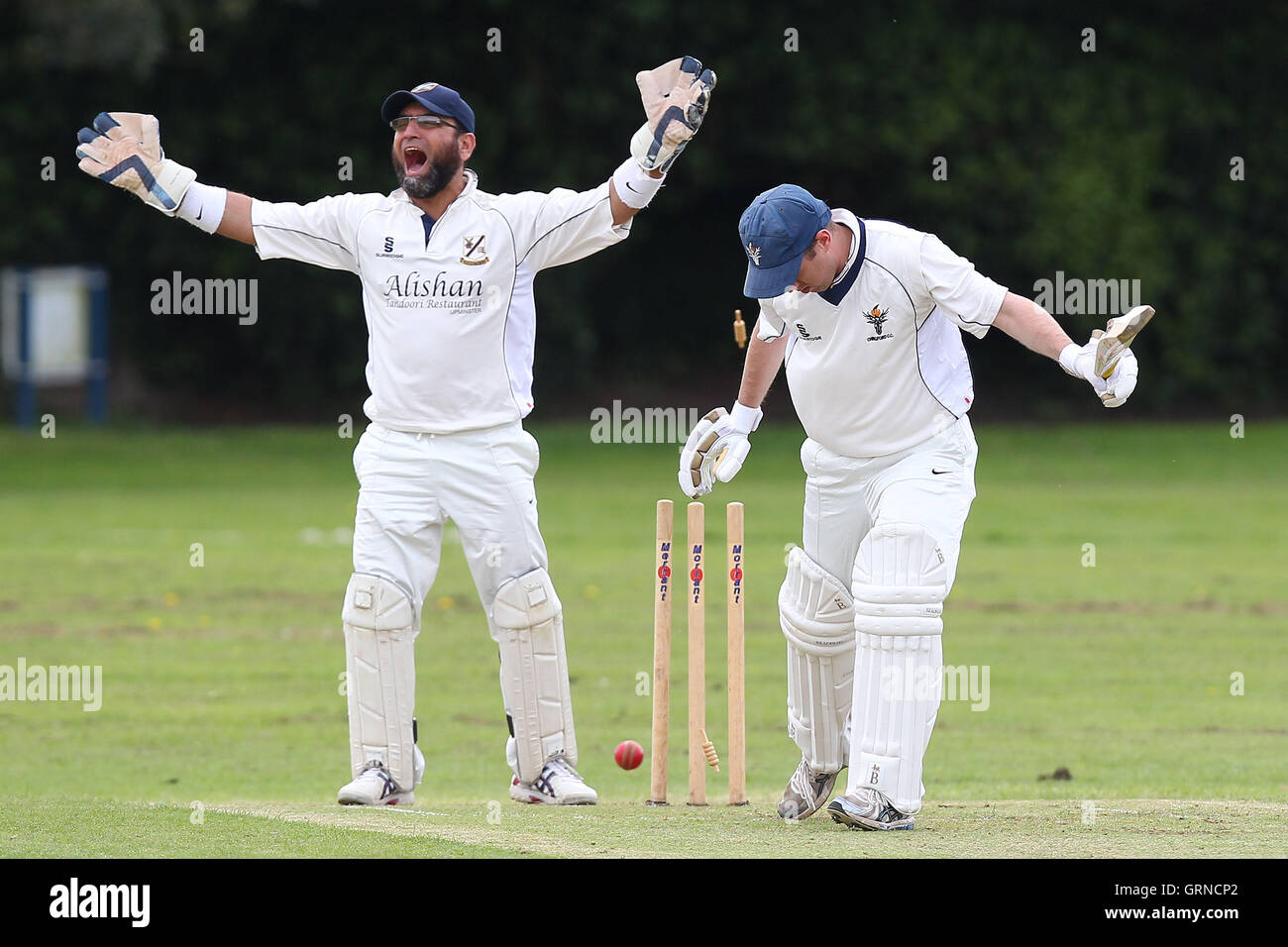 Andy Berry takes the second Chingford wicket as Freddie Butt looks on ...