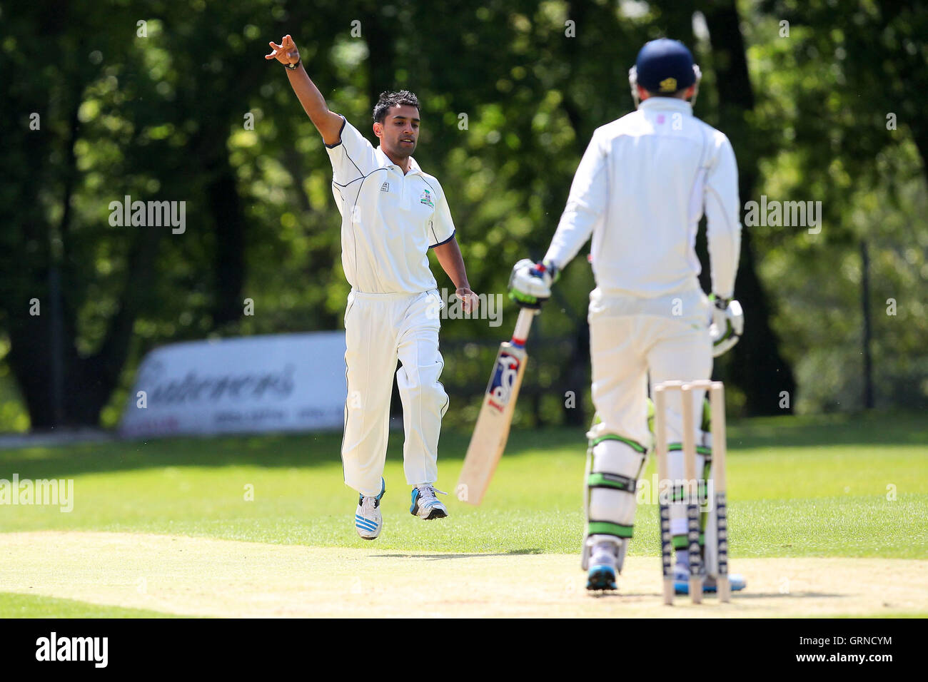 Zain Shahzad of Wanstead celebrates the first Chingford wicket ...