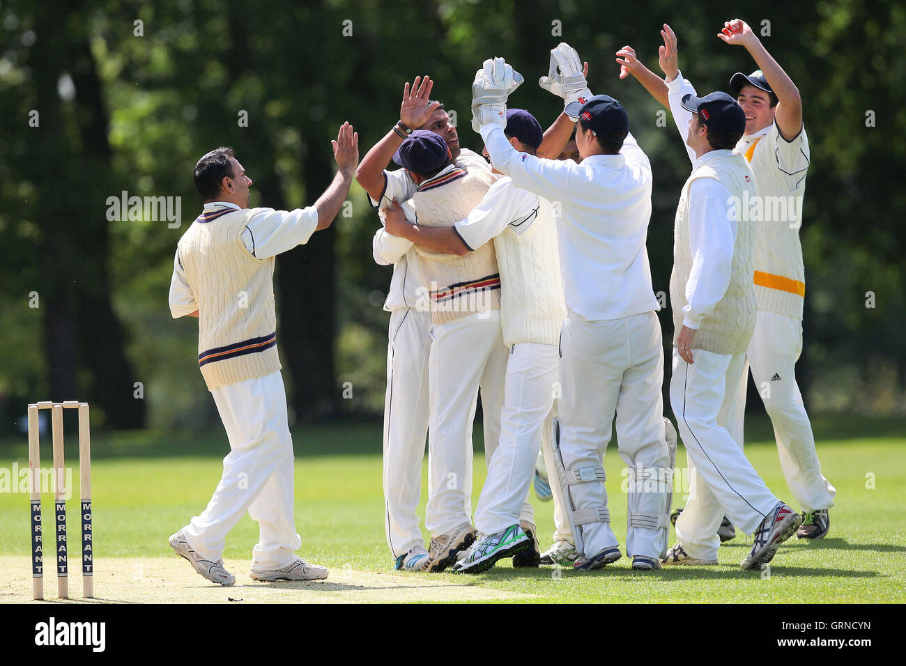 Zain Shahzad of Wanstead celebrates the first Chingford wicket ...