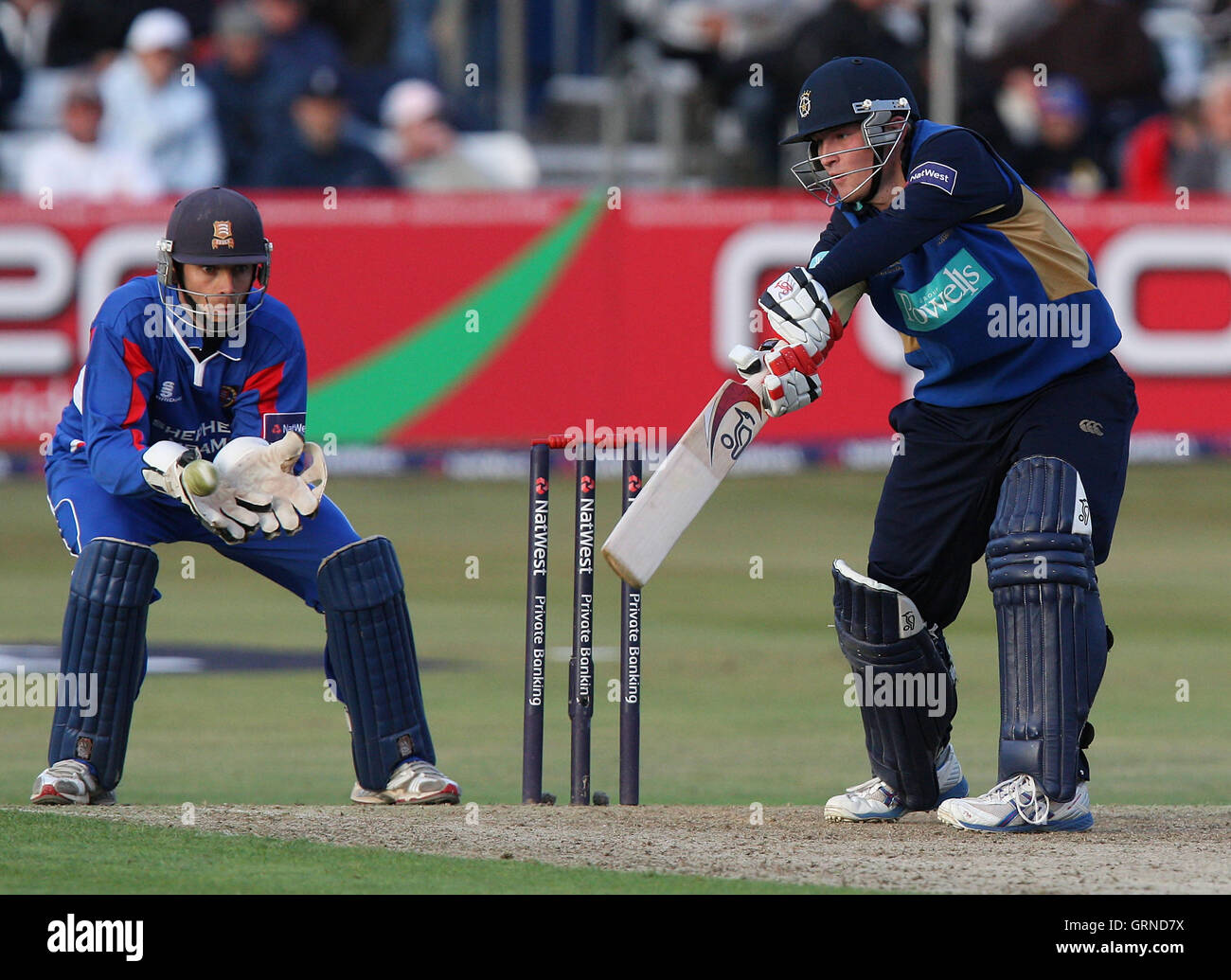 Chris Benham of Hampshire in batting action as James Foster looks on ...