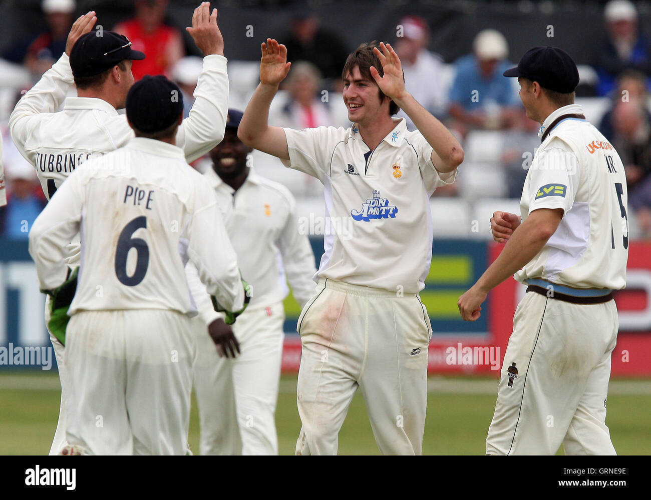 Jake Needham of Derbs is centre of attention having taken the wicket of ...