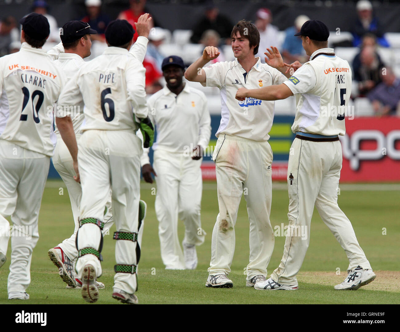 Jake Needham of Derbs is centre of attention having taken the wicket of ...