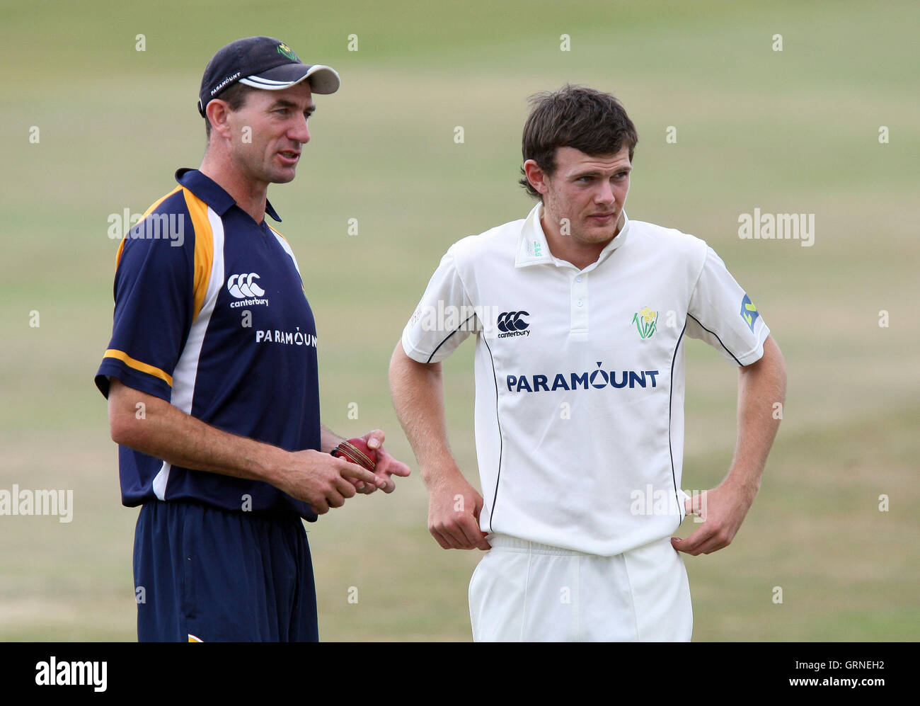 Glamorgan bowling coach Steve Watkin (L) and bowler James Harris ...