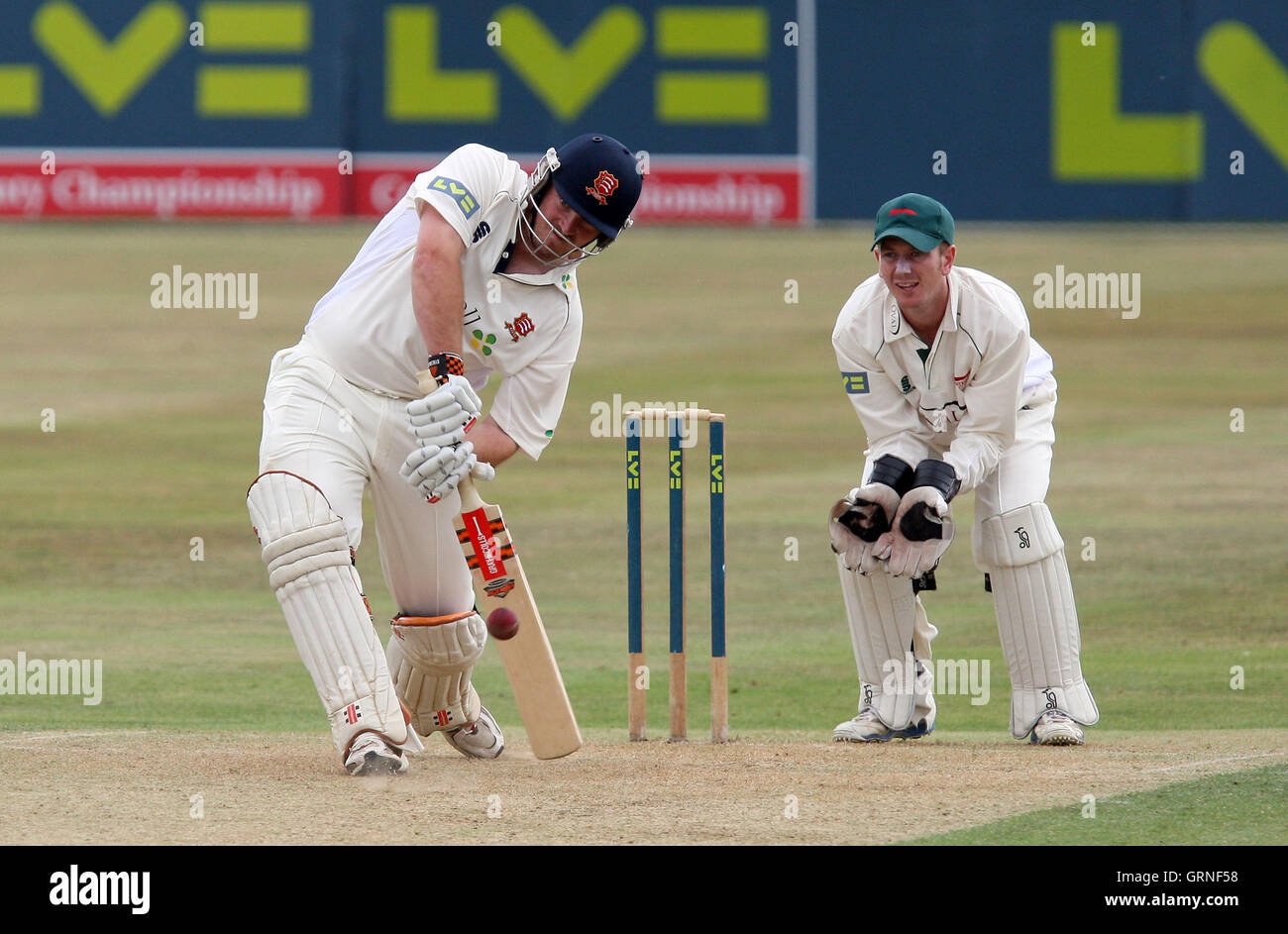 John Maunders hits out for Essex as Tom New looks on from behind the ...