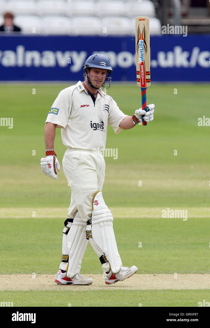 Cricket batsman raising bat hi-res stock photography and images - Alamy