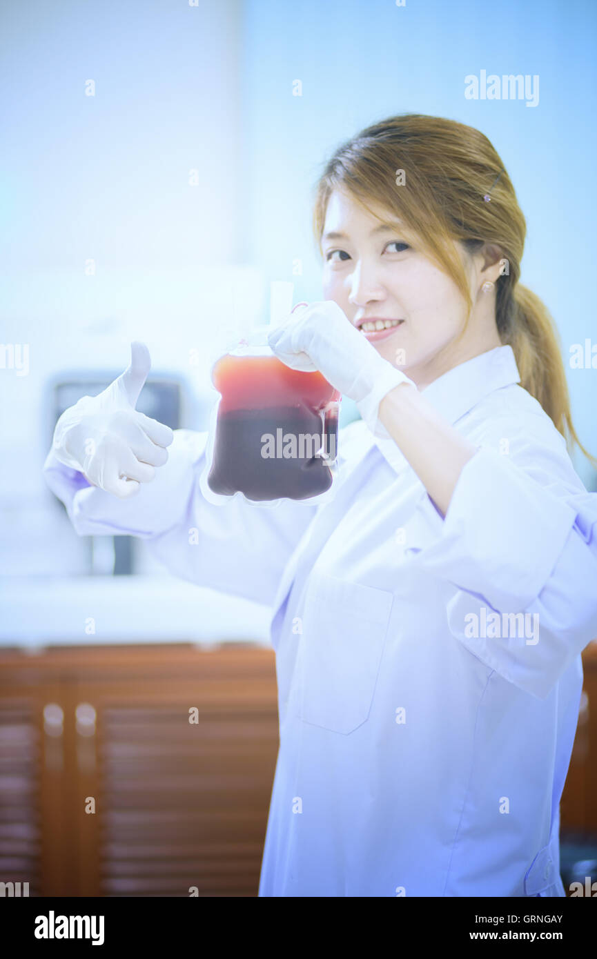 Bag of Blood in hand asian woman Doctor Stock Photo - Alamy