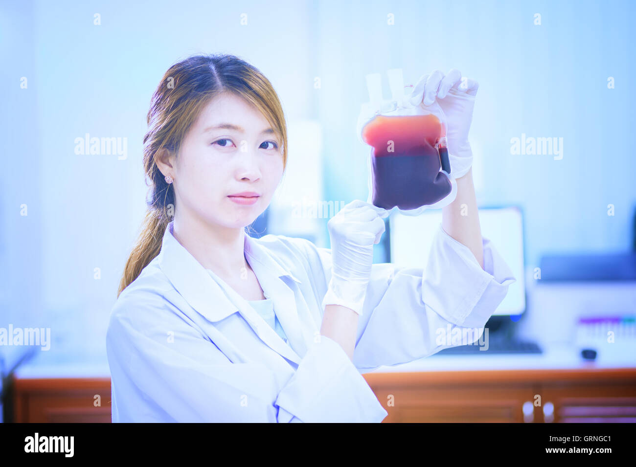 Bag of Blood in hand asian woman Doctor Stock Photo - Alamy