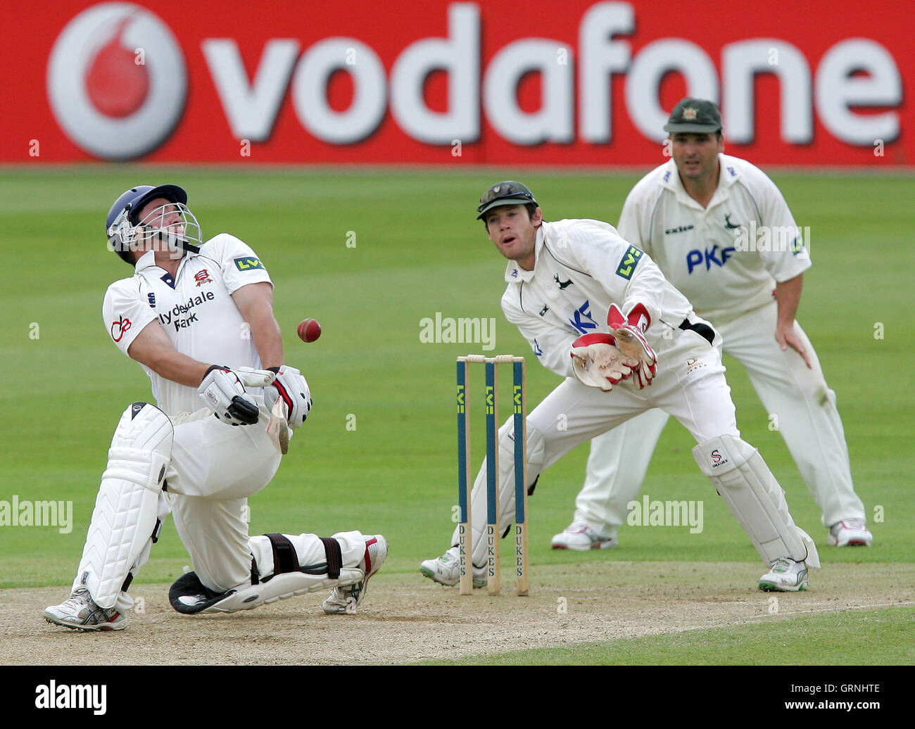 Graham Napier of Essex gets in a tangle watched by Chris Read of Notts ...