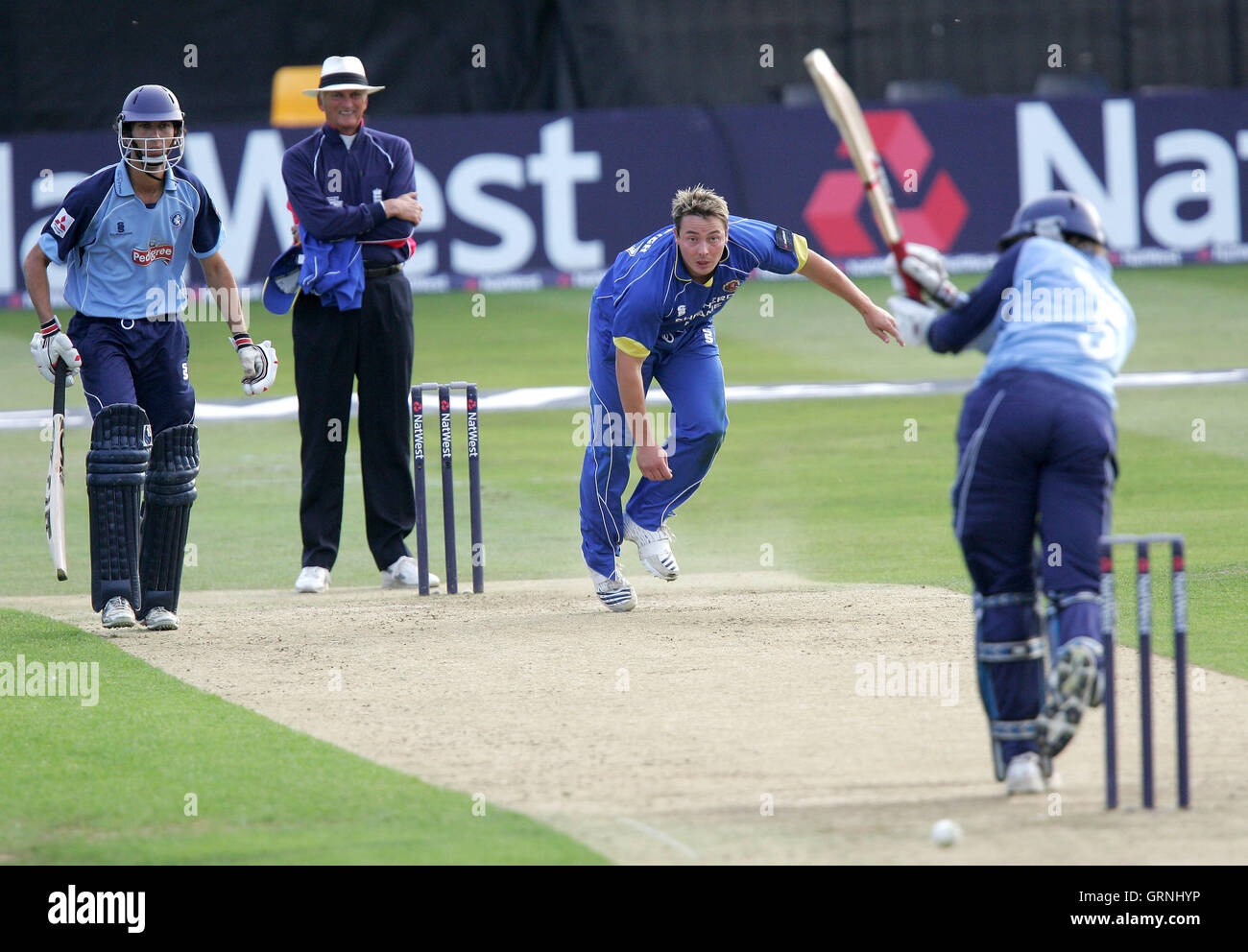 Graham Napier of Essex bowls to Alex Gidman as Kadeer Ali backs up ...