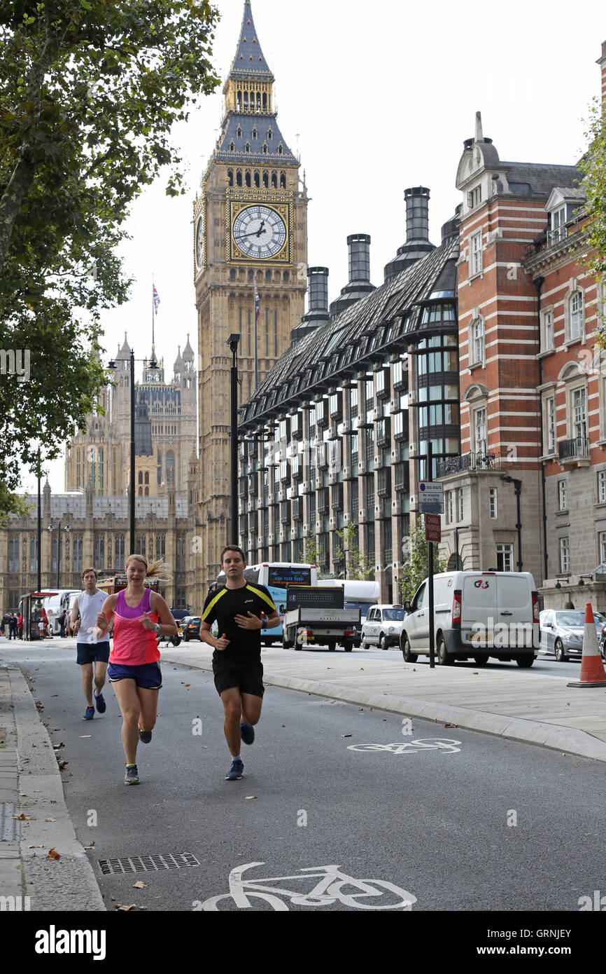 Runners use London's new, segregated cycle path on Victoria Embankment ...