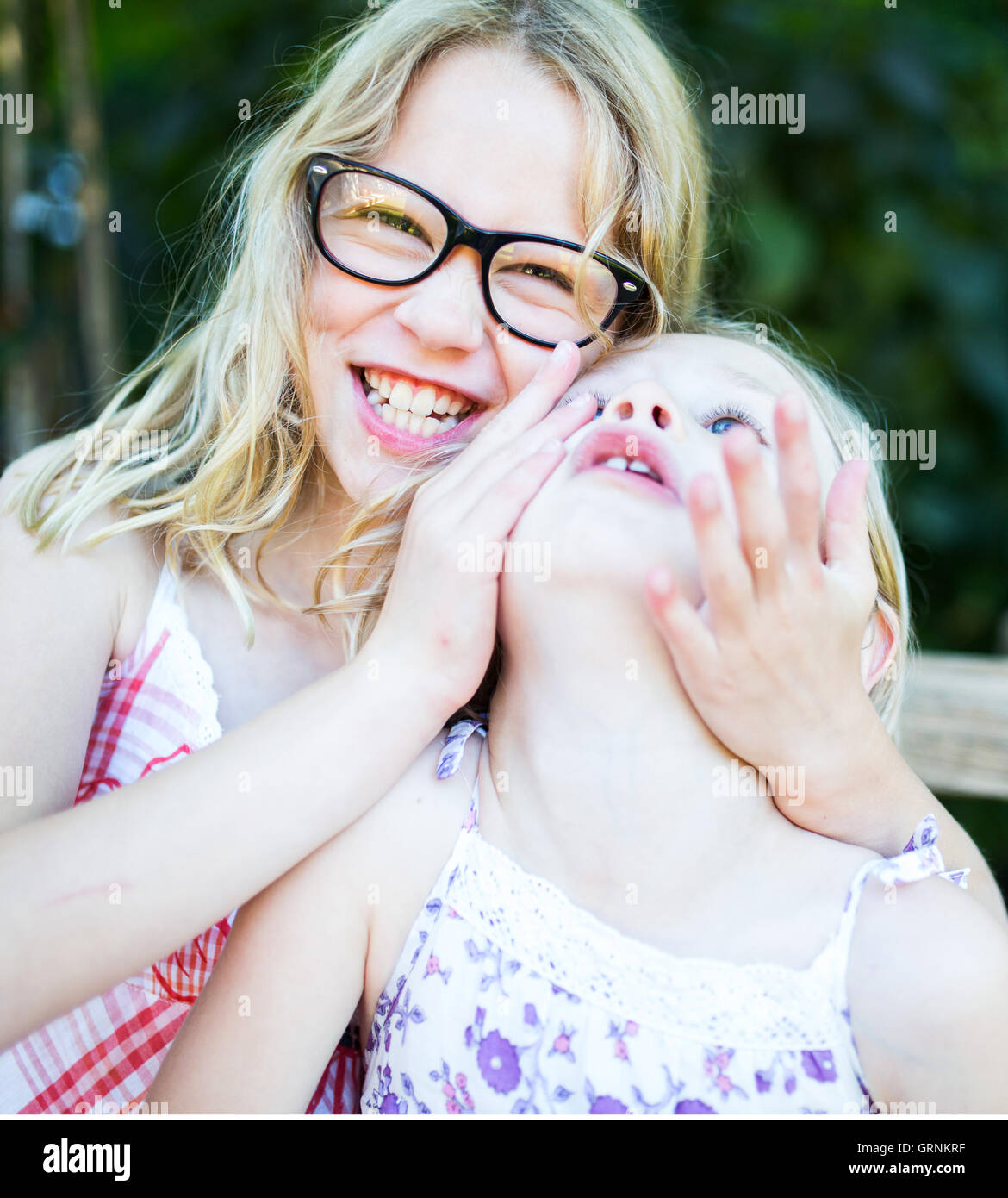 Lifting up sister hi-res stock photography and images - Alamy
