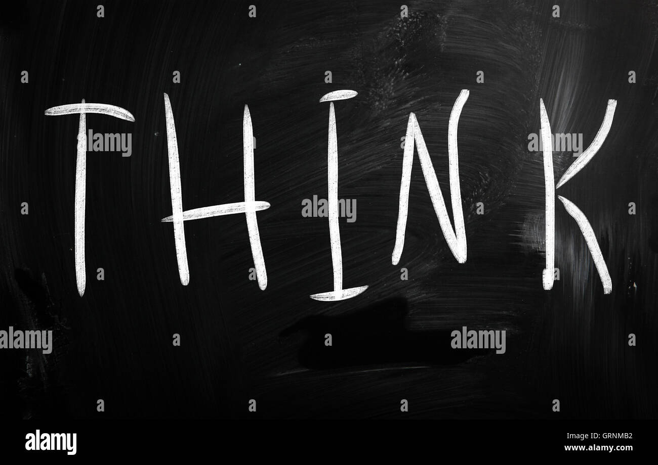 The word "Think" handwritten with white chalk on a blackboard Stock ...