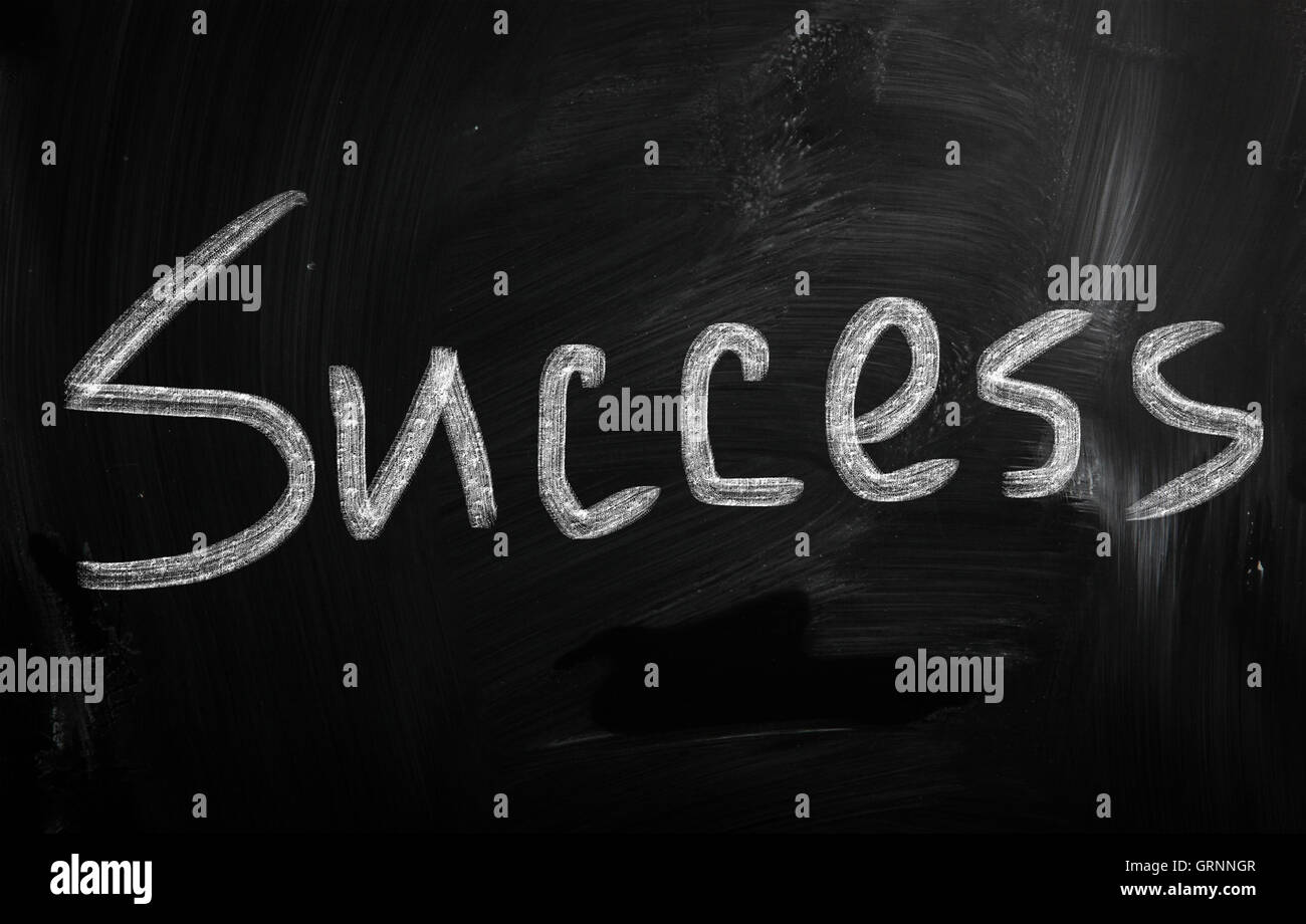 The word 'Success' handwritten with white chalk on a blackboard Stock ...