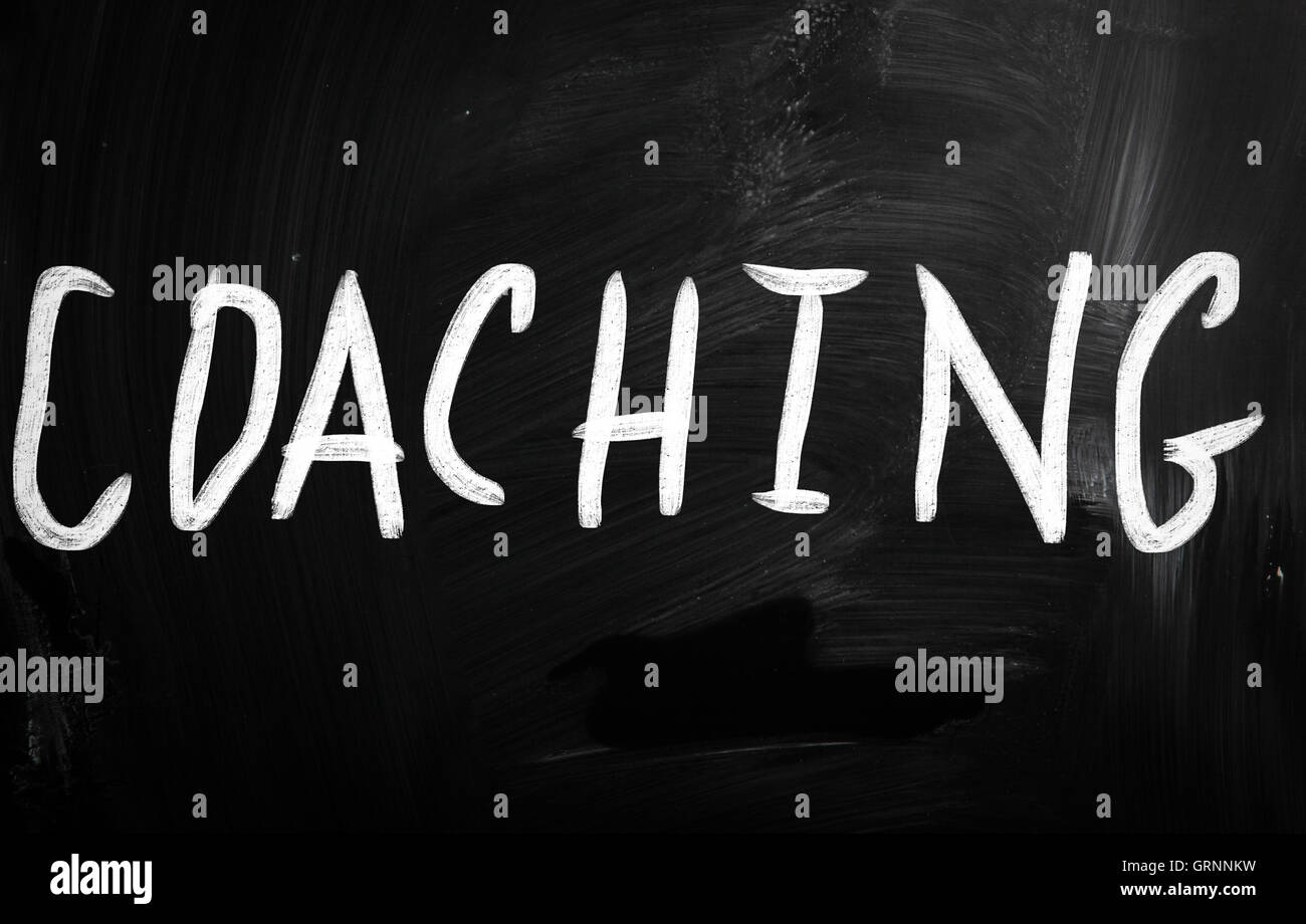 Coaching handwritten with white chalk on a blackboard Stock Photo - Alamy