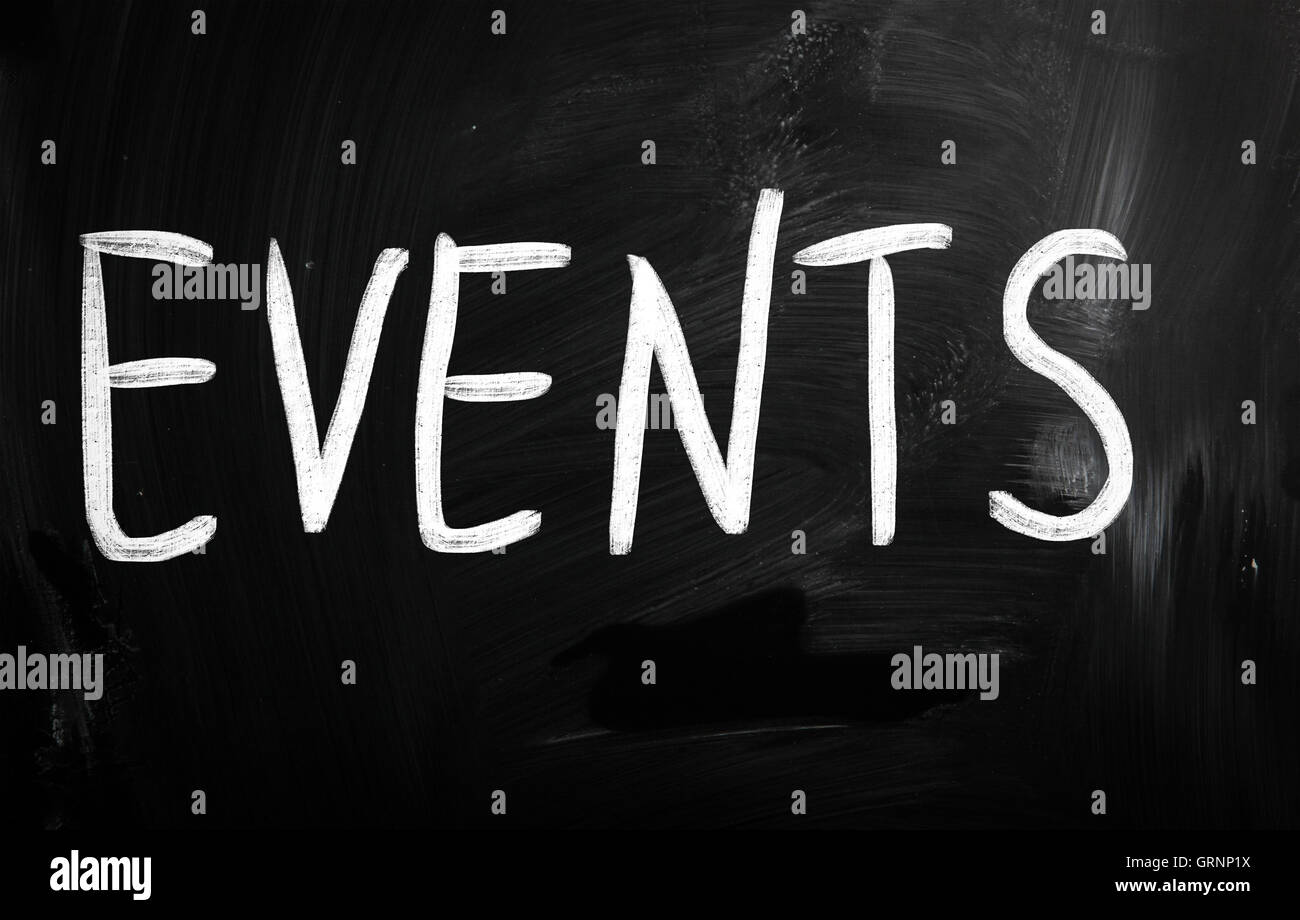 Events handwritten with white chalk on a blackboard Stock Photo - Alamy
