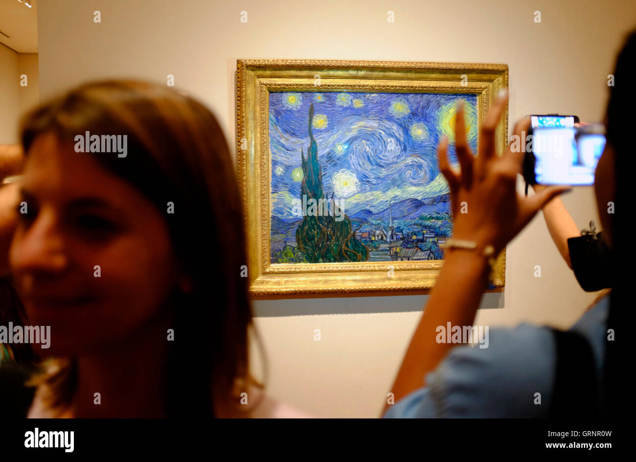 Visitors taking photos of "The Starry Night" by Vincent Van Gogh at ...