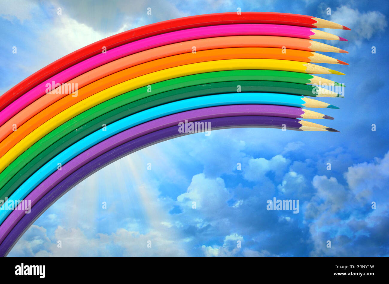 colored pencils and rainbow Stock Photo - Alamy