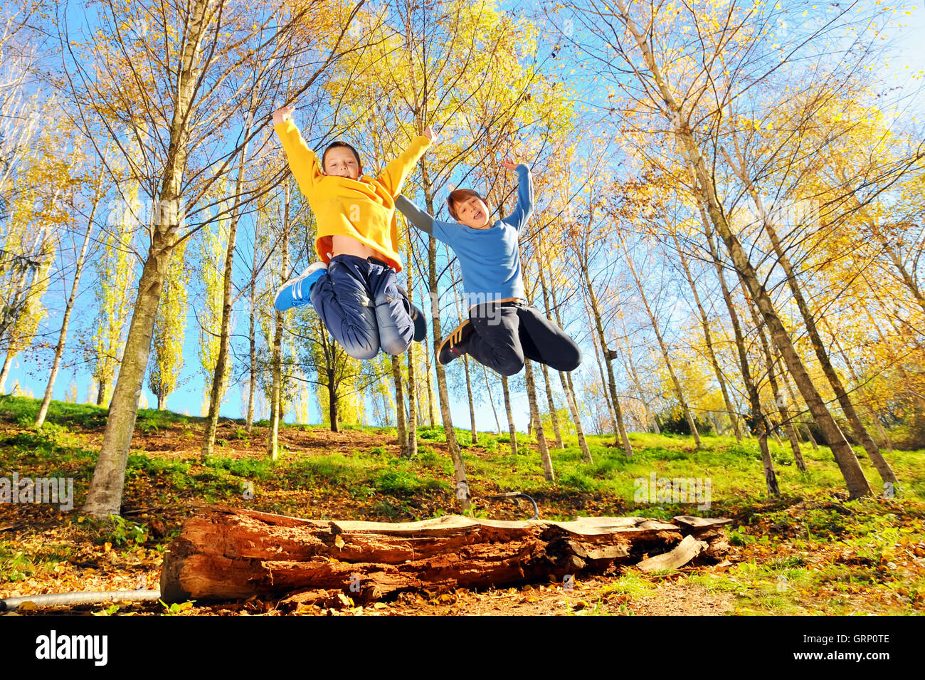 two boys jumping Stock Photo - Alamy
