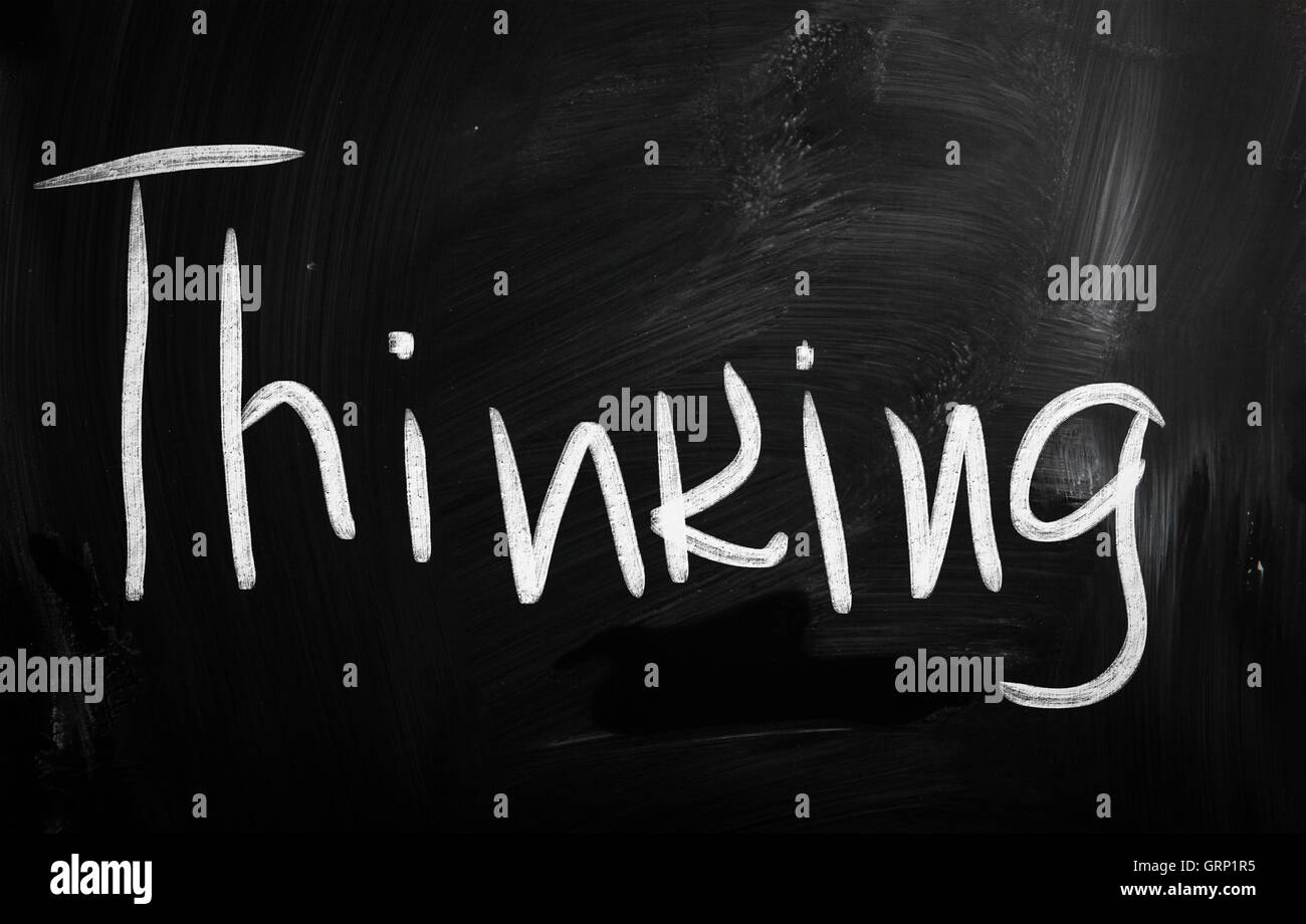 The word "Thinking" handwritten with white chalk on a blackboard Stock ...