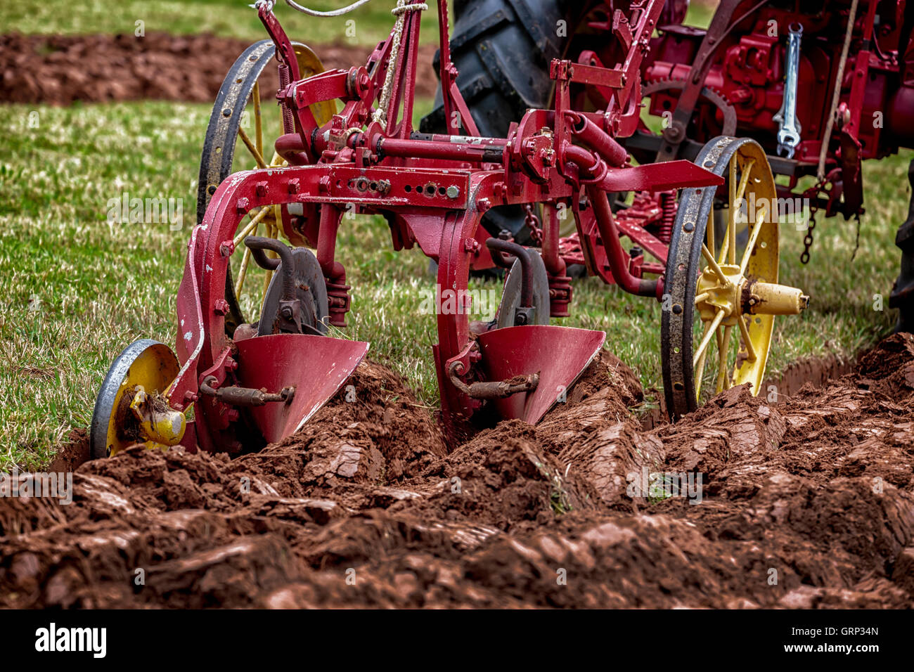 Antique plow turning the sod Stock Photo - Alamy