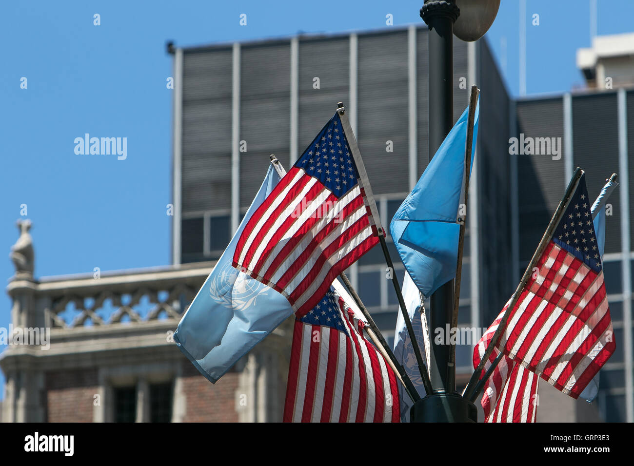 Small American and UN flags flying on a lamp post Stock Photo - Alamy