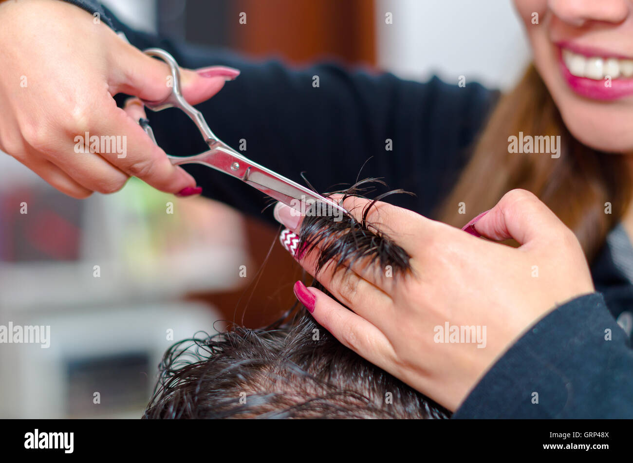 How to make a nice haircut, hair between fingers and scissors Stock ...