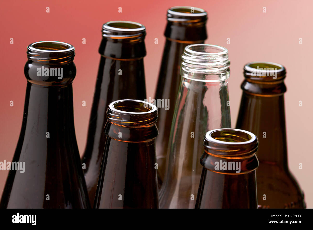 Tops of empty glass bottles Stock Photo - Alamy