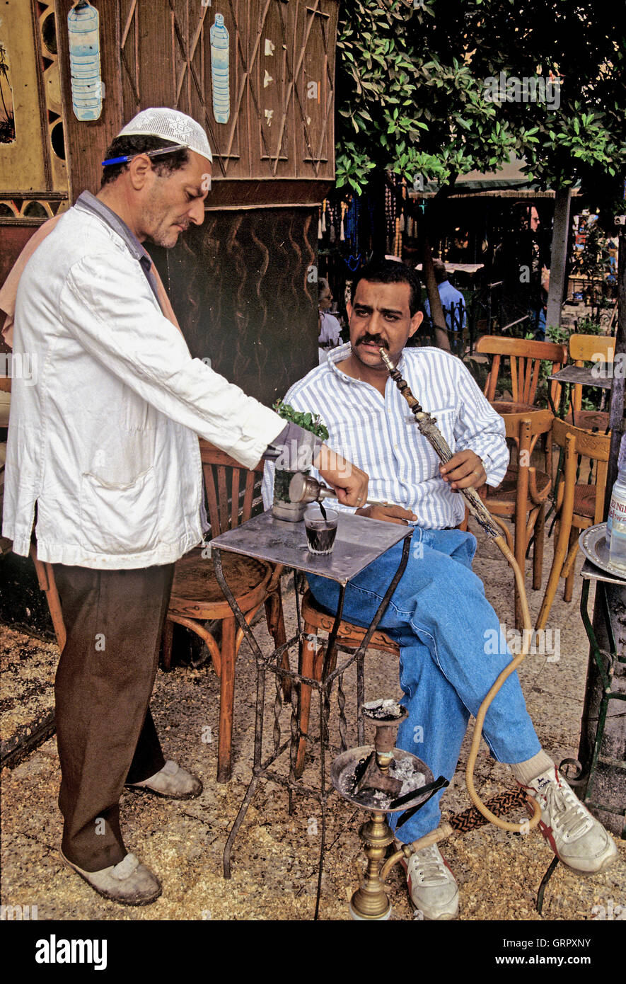 Young Saudi Arabian Man Smoking Arabic Hubble Bubble Hookah, 60% OFF