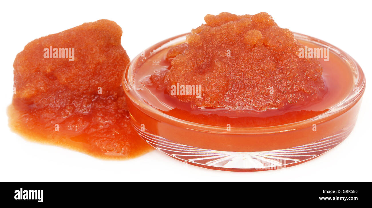 Molasses in a glass bowl over white background Stock Photo - Alamy