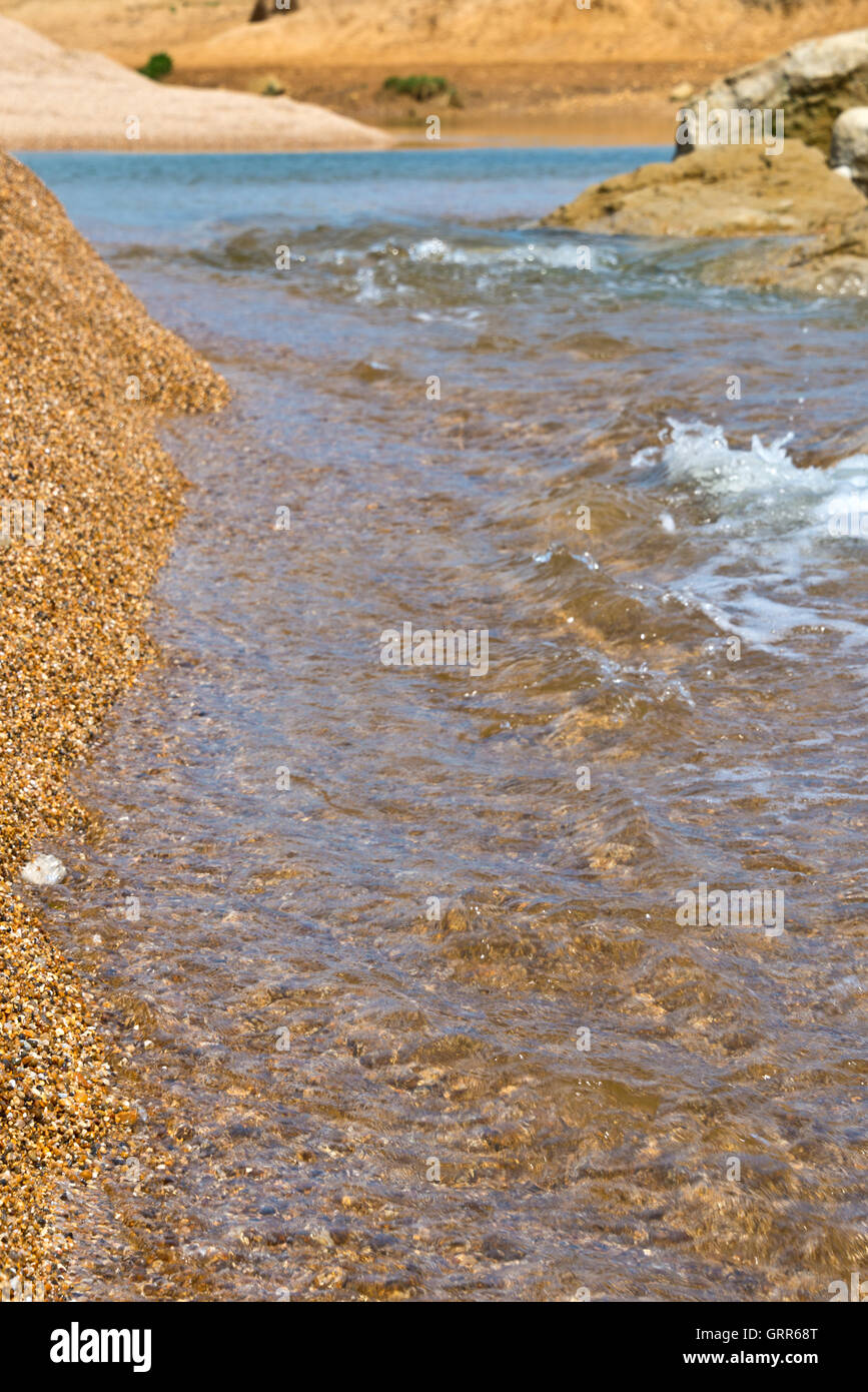 River Bride cutting its way through the shingle on its way down to ...