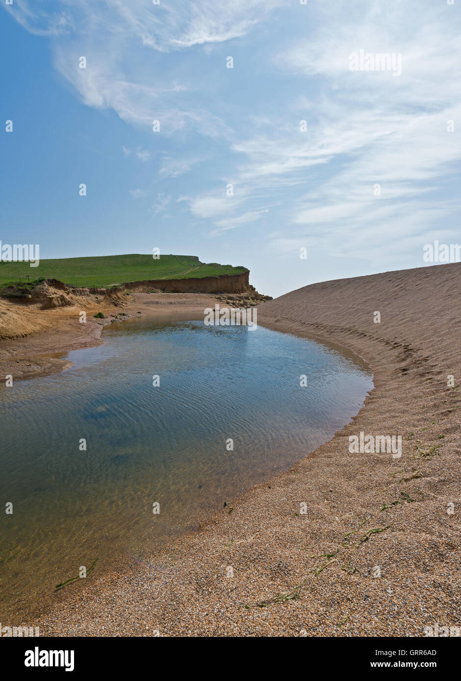 looking across the lagoon towards Burton Cliffs at the end of River ...