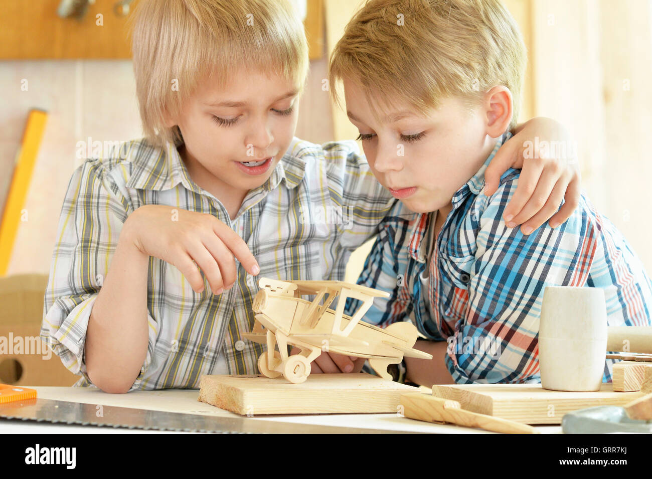 boys working with wood in workshop Stock Photo - Alamy