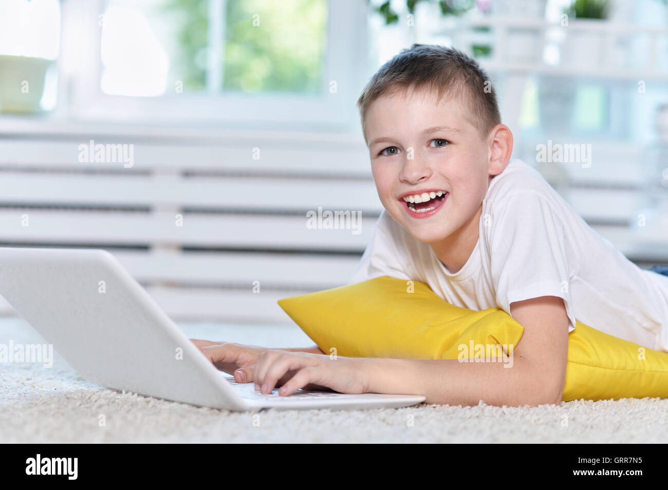 Young boy and laptop computer Stock Photo - Alamy