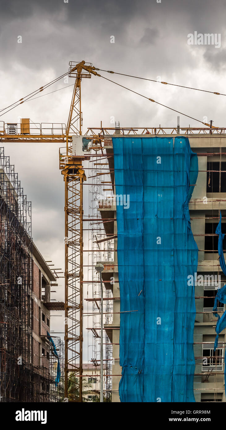 Crane at construction site building tall buildings Stock Photo - Alamy