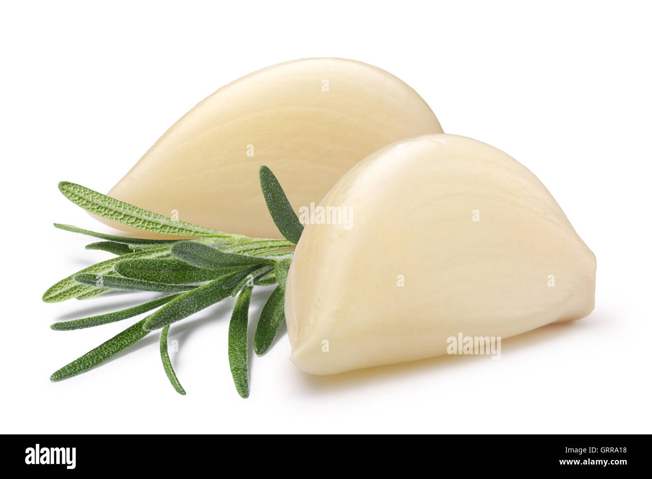 Husked and split garlic cloves with rosemary. Clipping paths, shadow ...