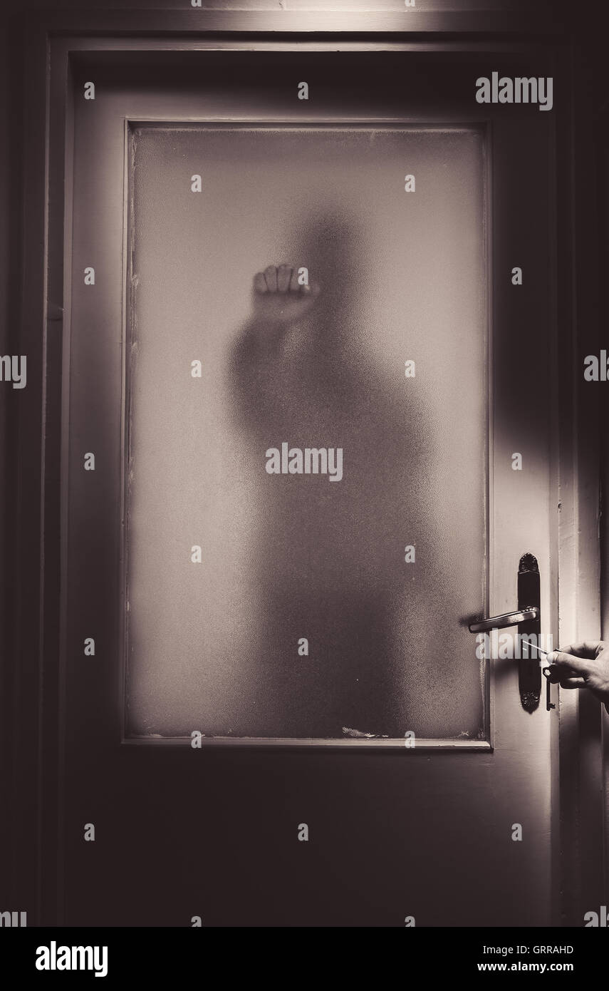 Silhouette behind door hi-res stock photography and images - Alamy