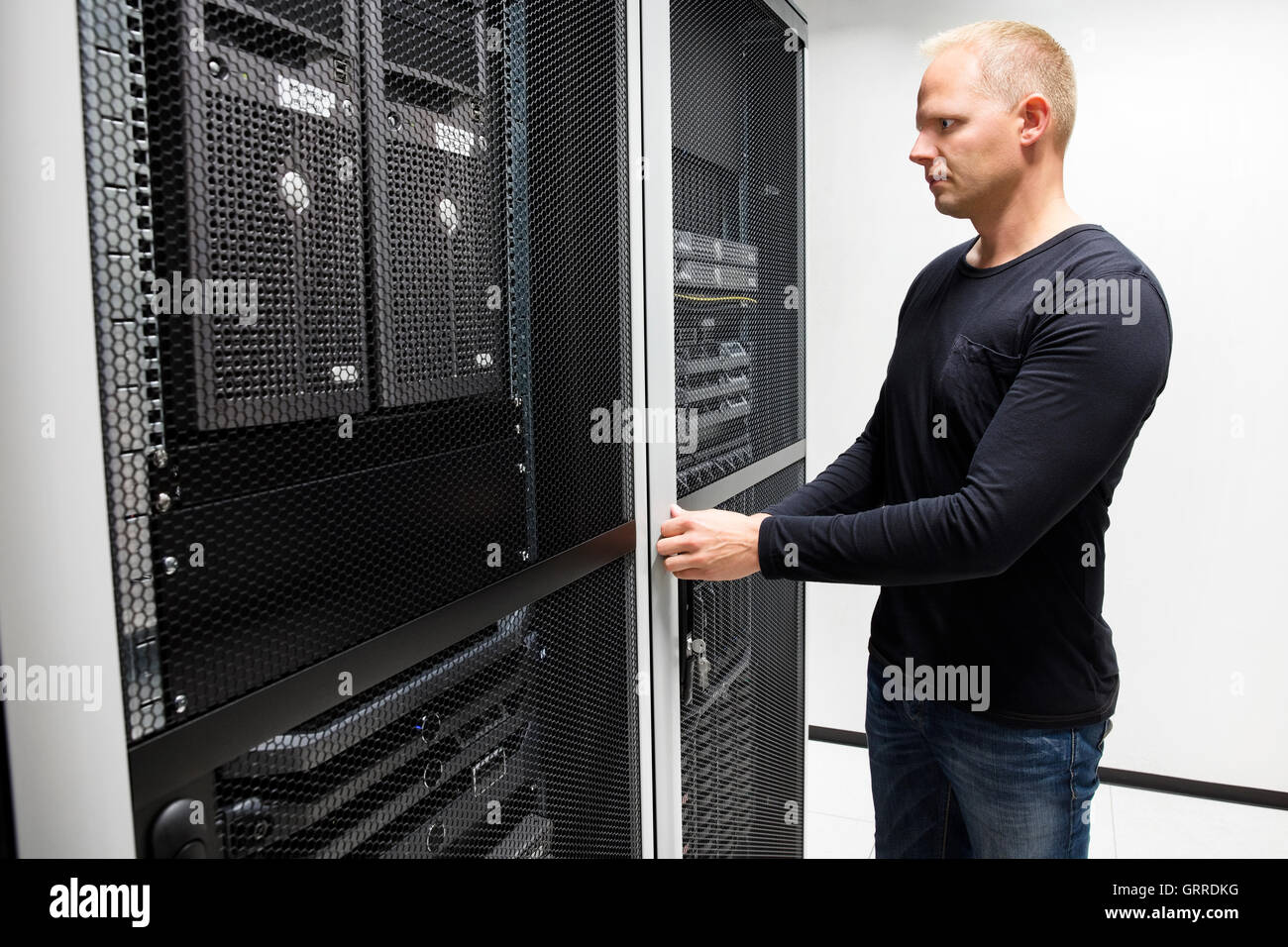 Computer engineer opening server hi-res stock photography and images ...