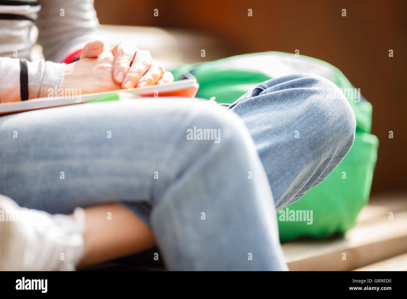 feet girl sitting on bench, close-up Stock Photo - Alamy