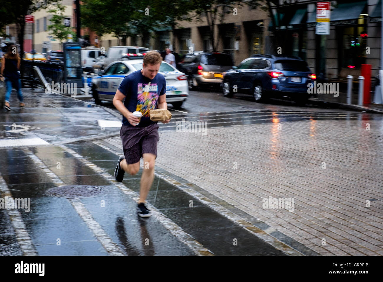 Running down the street in the rain with a take away lunch Stock Photo ...