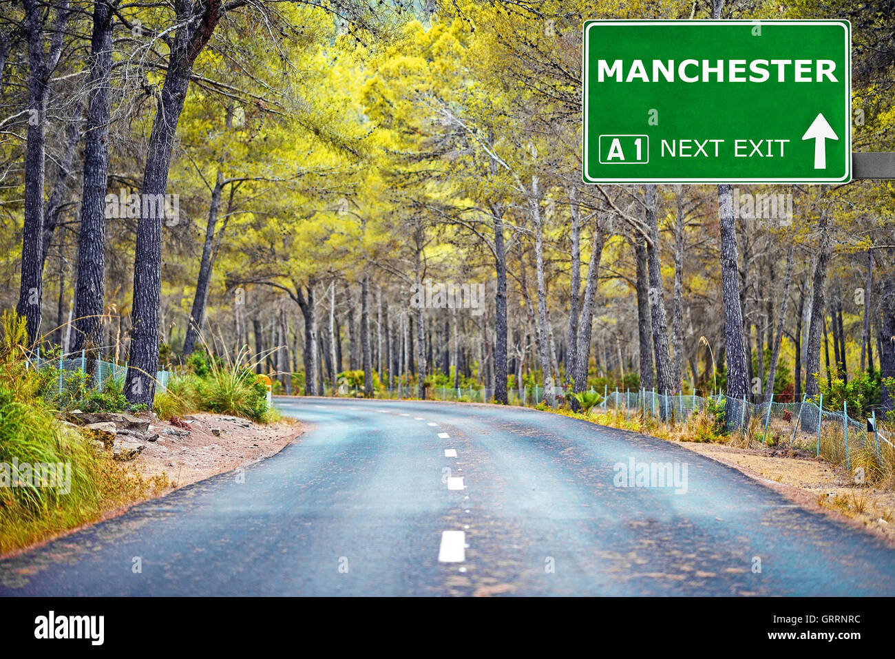 MANCHESTER road sign against clear blue sky Stock Photo - Alamy