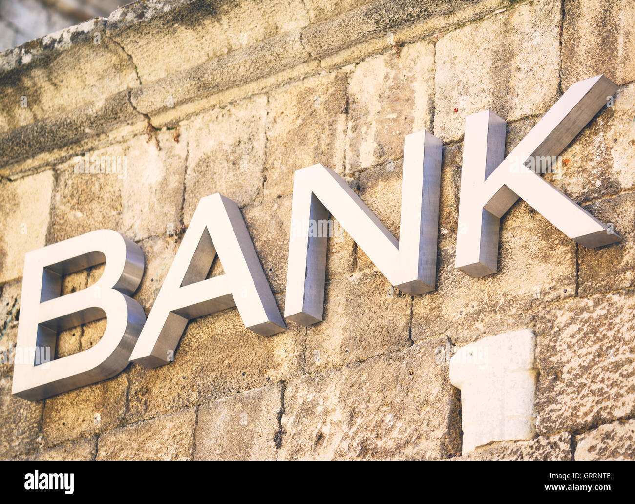 Bank sign carved in stone on building Stock Photo - Alamy