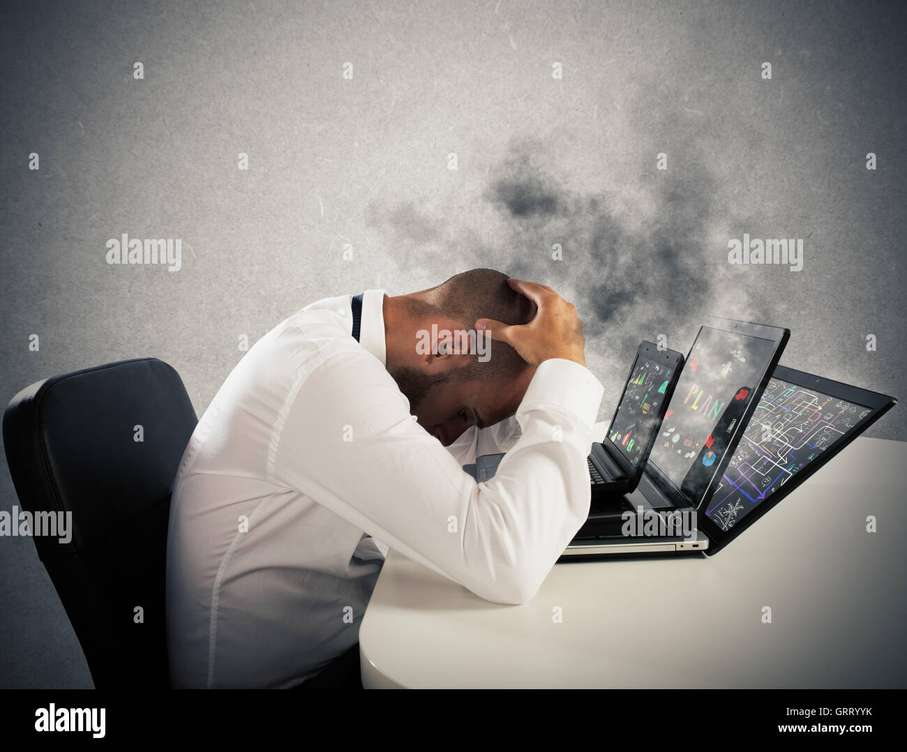Businessman overworked worn computers Stock Photo - Alamy