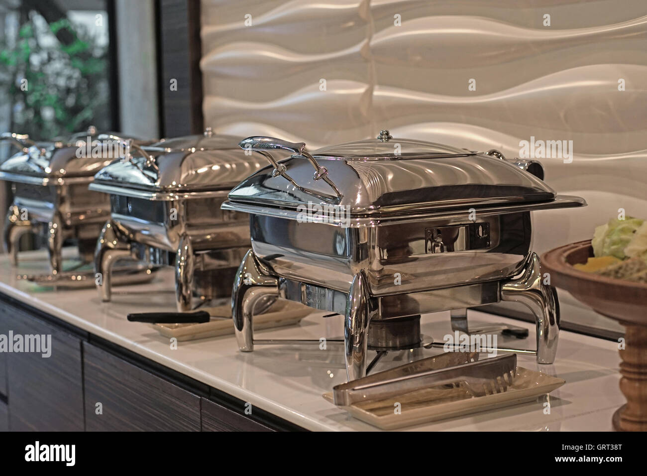 row of food service steam pans on buffet table Stock Photo - Alamy
